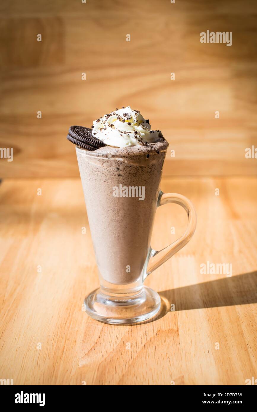 Iced coffee milkshake on a woodon table with a wood background Stock ...