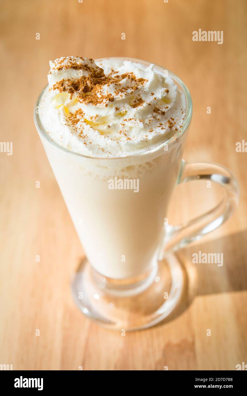 Iced coffee milkshake on a woodon table with a wood background Stock ...