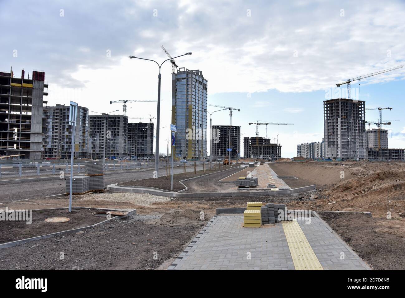 Laying paving slabs at construction site. Process of installing paving ...