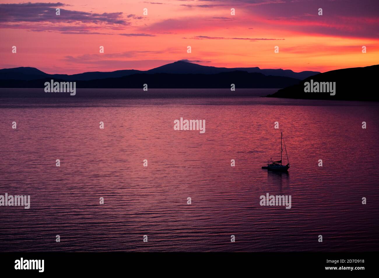 View to Skye from Applecross at sunset with yacht Stock Photo - Alamy