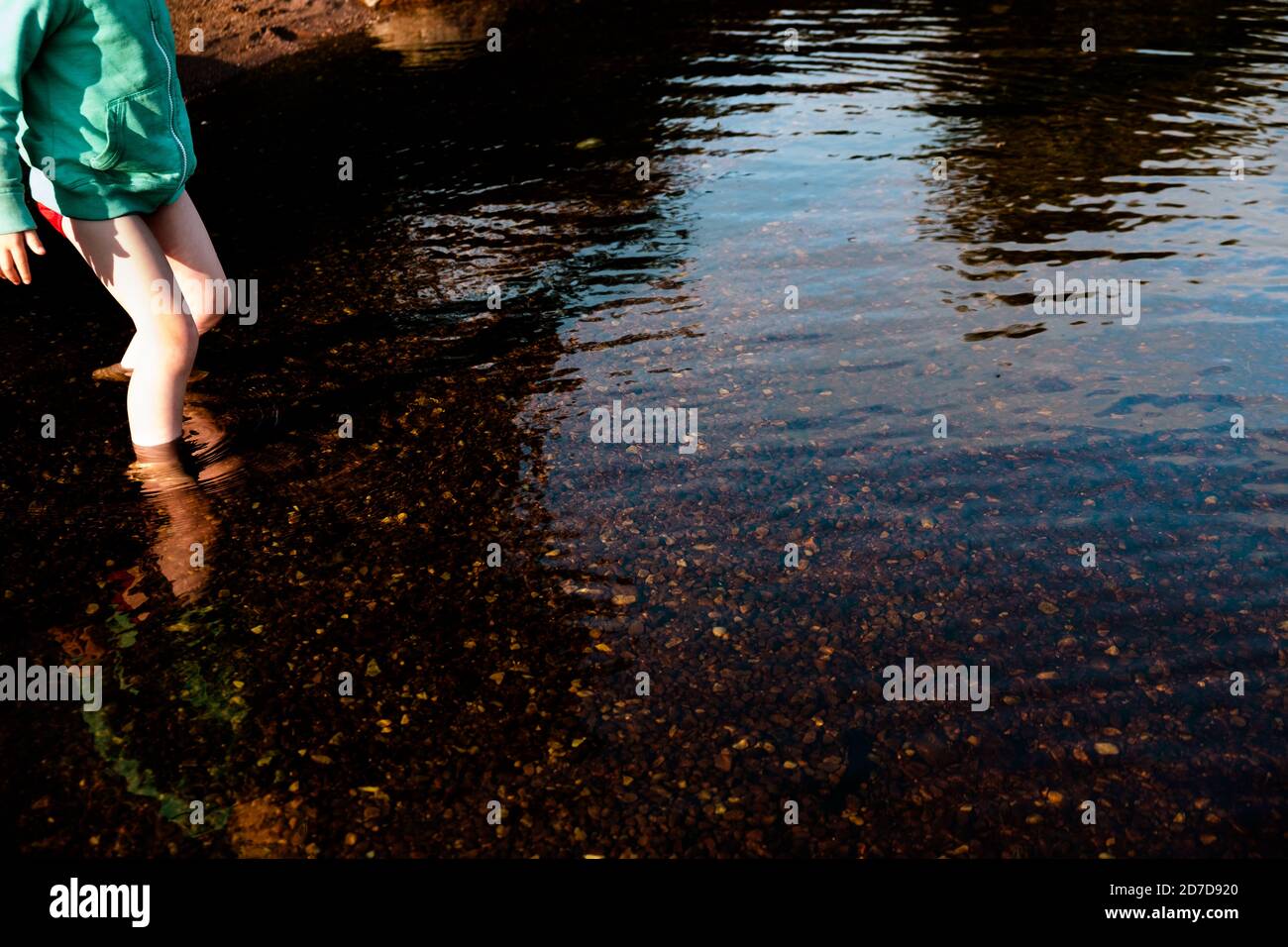 child paddling in the water Stock Photo - Alamy