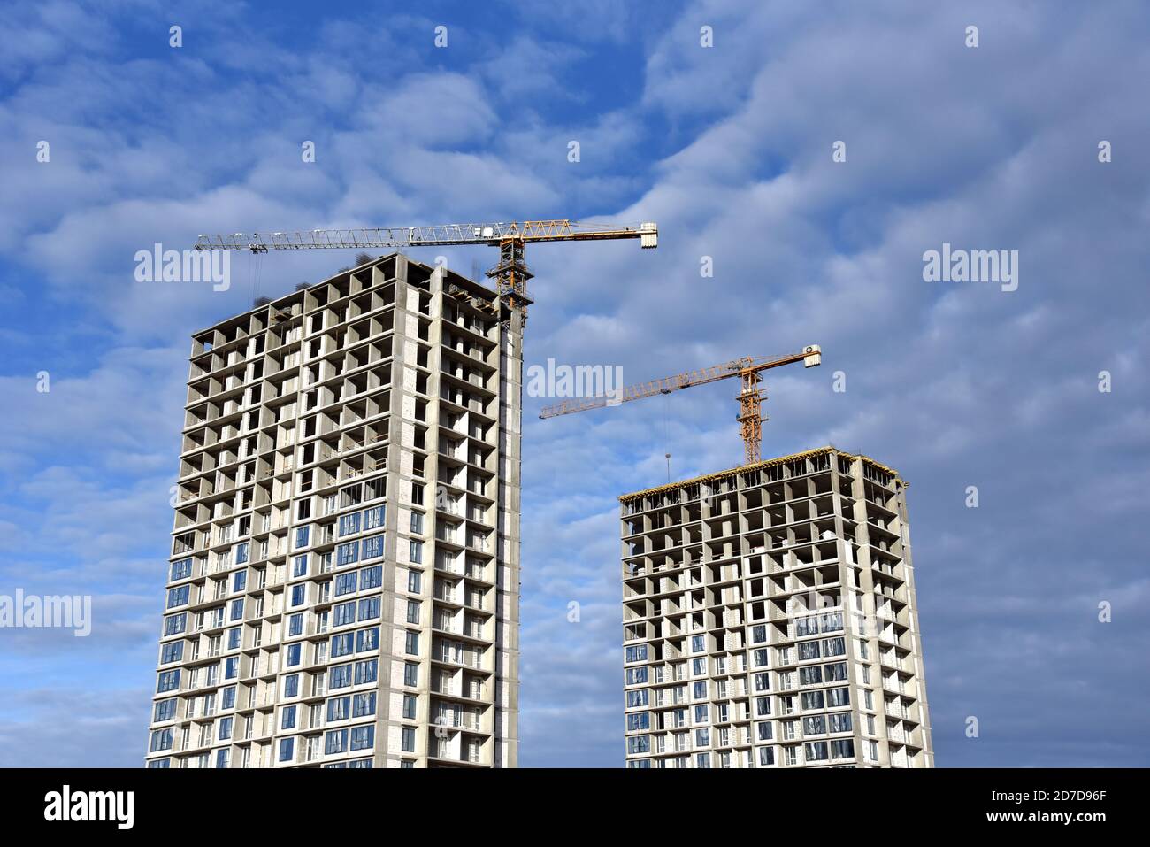 Tower cranes build the high-rise building. Crane working at ...