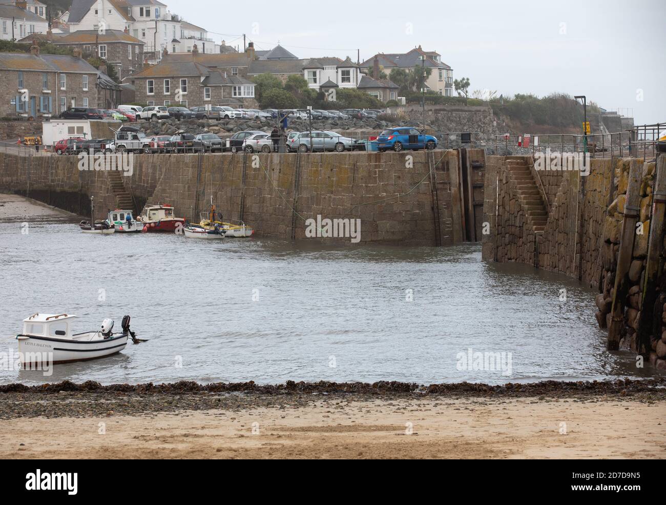 Boats in the harbour at high tide in Mousehole Cornwall, UK Stock Photo ...