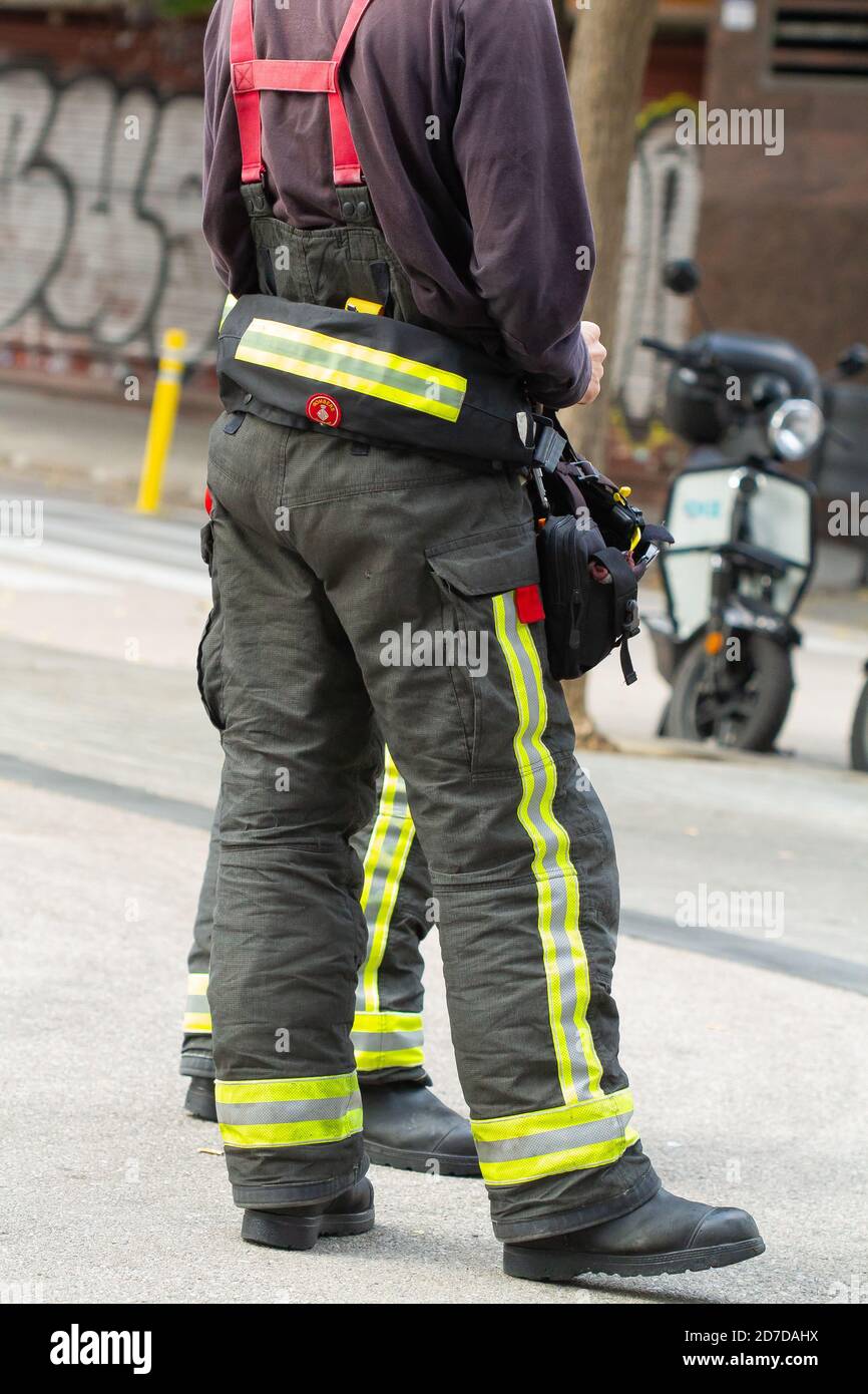Vertical back view of a fireman in a uniform Stock Photo - Alamy