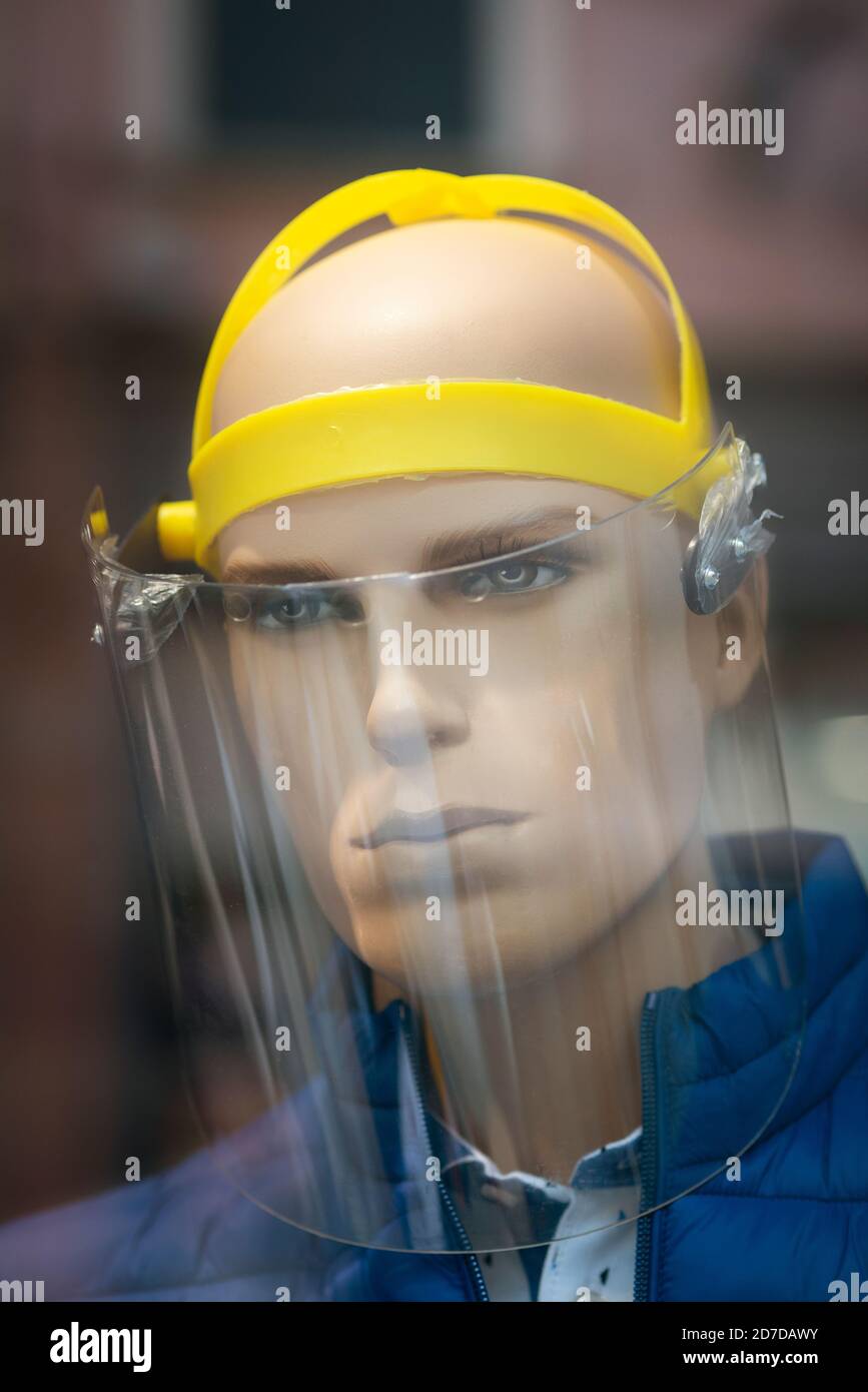 Mannequin in Protective Screen in the Window of a Clothing Store Stock ...