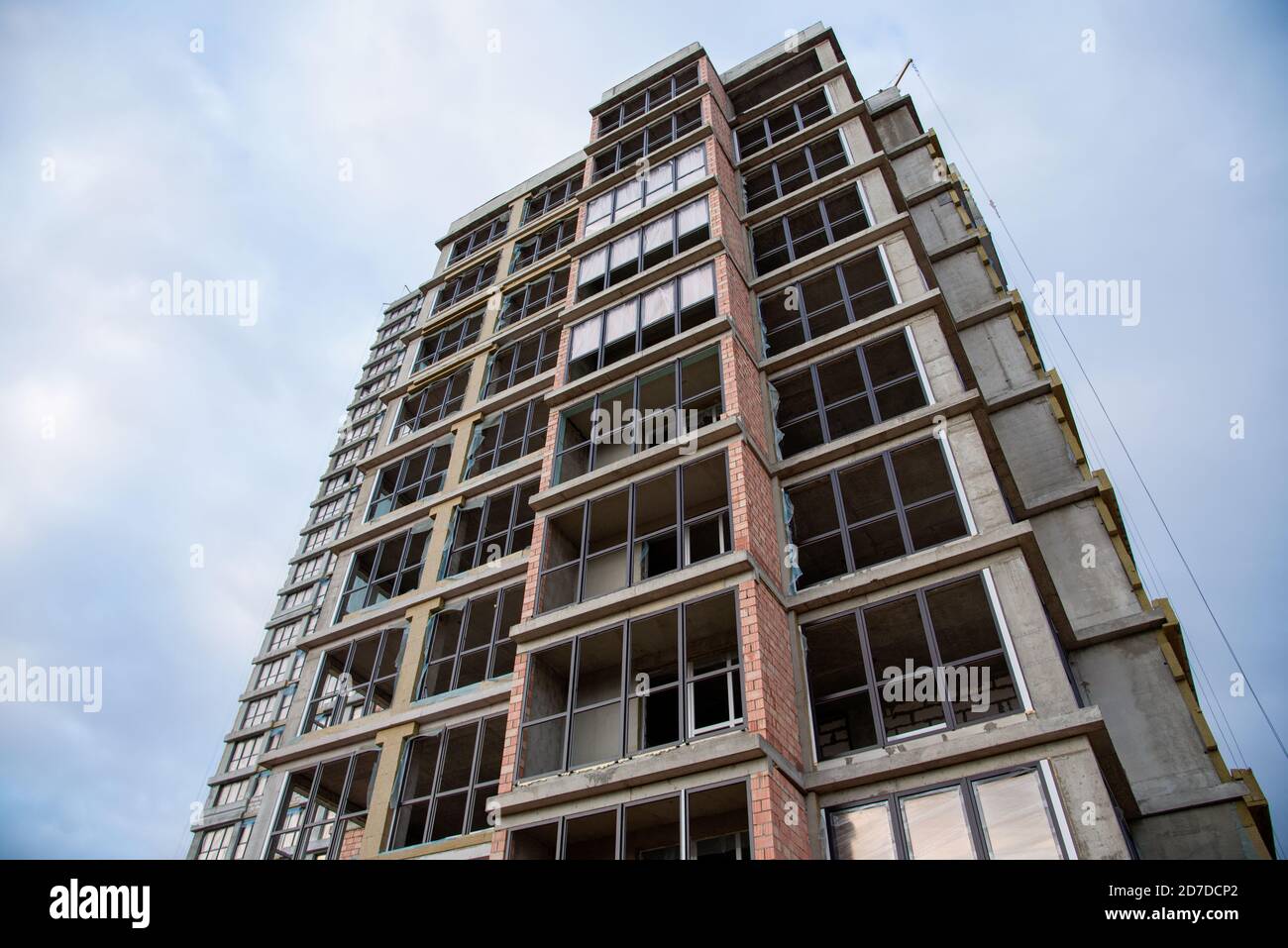 Installation of double-glazed windows in a multi-storey building at a ...