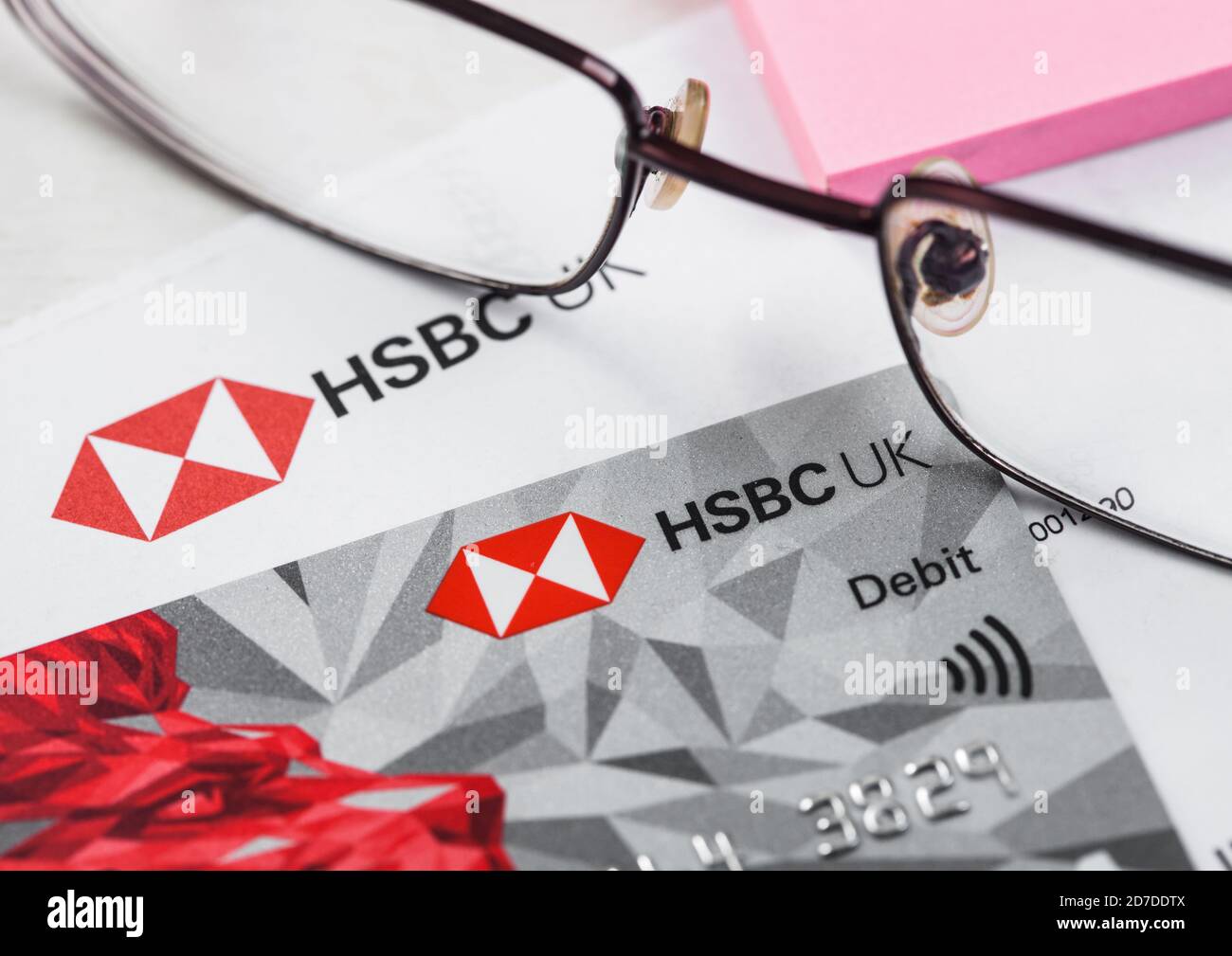 LONDON, UK - OCTOBER 14, 2020: HSBC UK bank debit card with glasses and ...