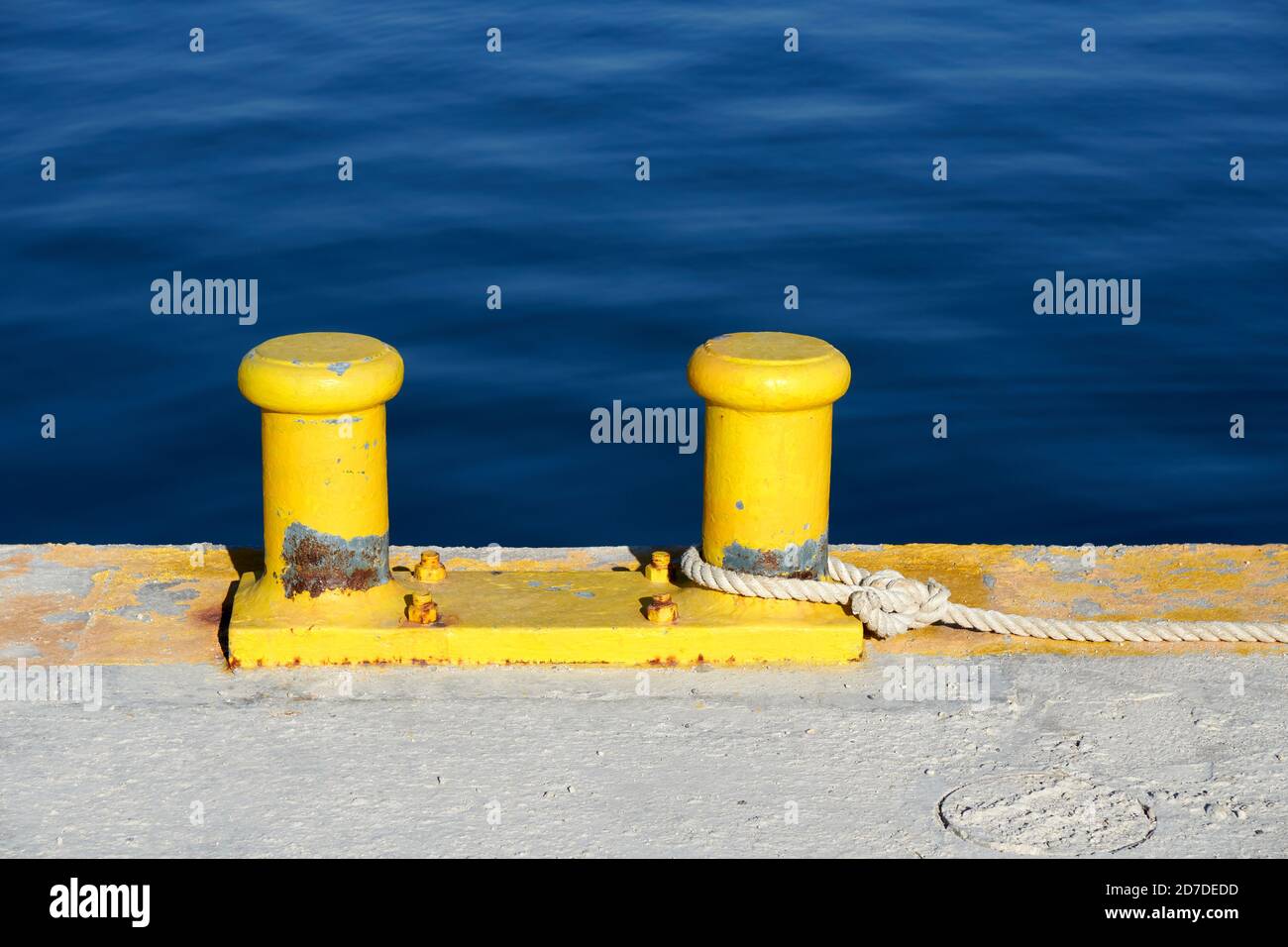 metal bollard post with clear blue sea in the background Stock Photo ...