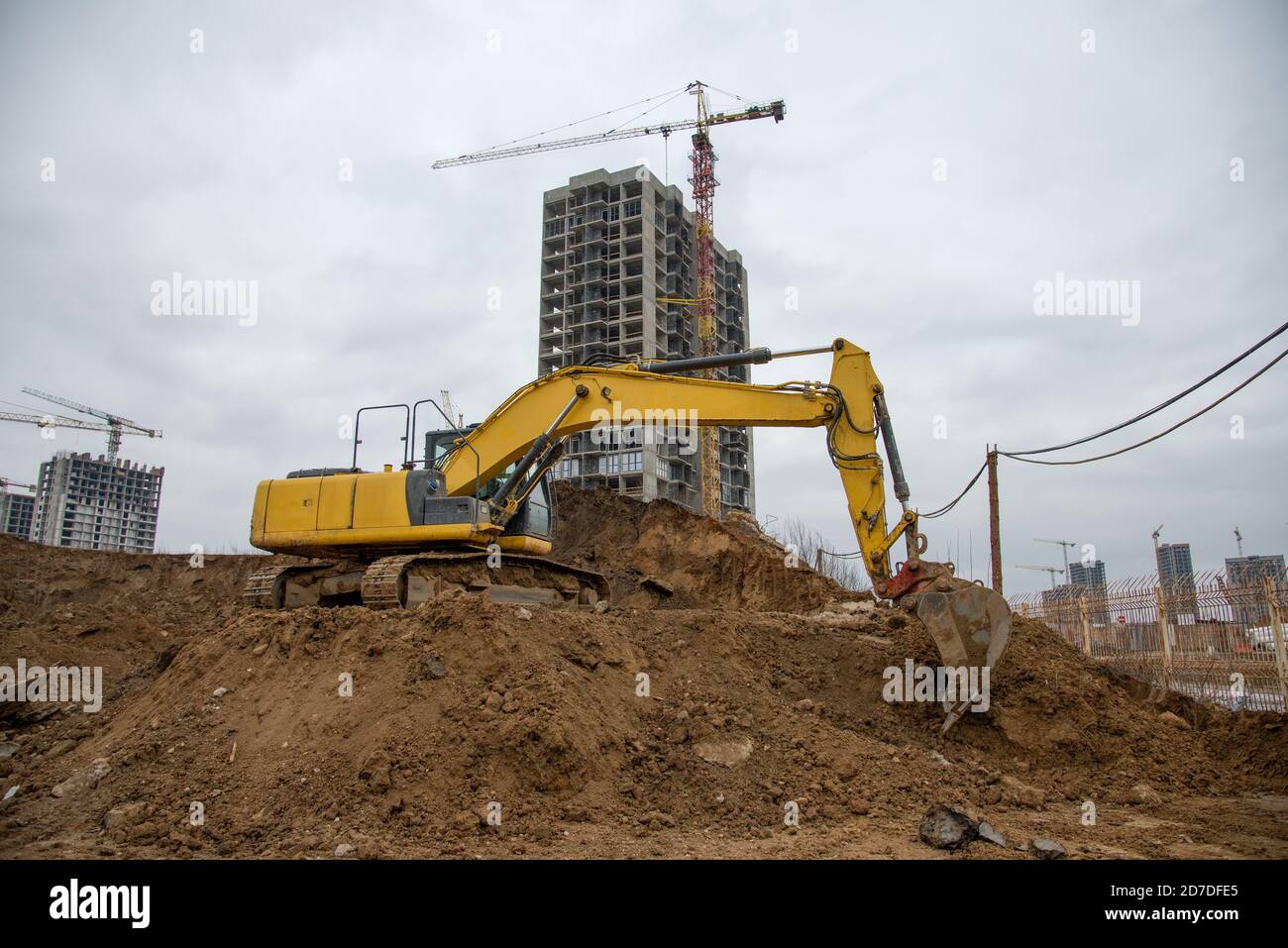 Track-type excavator during earthmoving at construction site. Backhoe ...