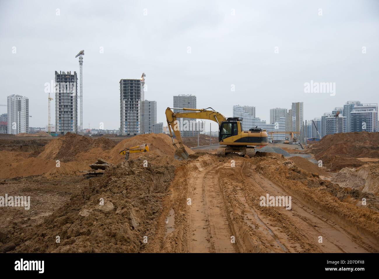 Track-type excavator during earthmoving at construction site. Backhoe ...