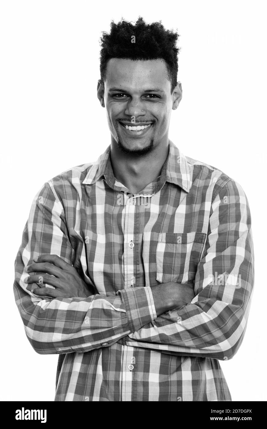 Studio shot of young happy African man smiling with arms crossed Stock ...