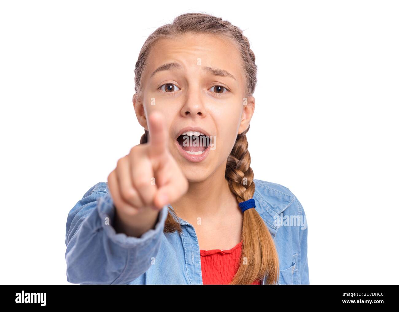 Happy teenage girl pointing up, gesturing idea or doing number one ...
