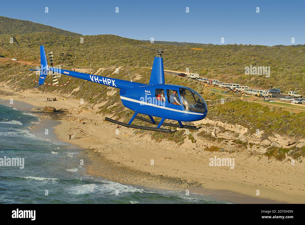 Robinson R44 Clipper helicopter low over a Western Australian beach ...