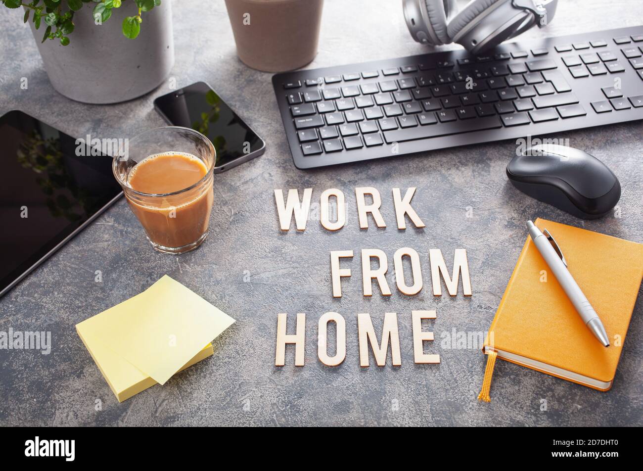 work from home text desk with keyboard computer smartphone notebook ...