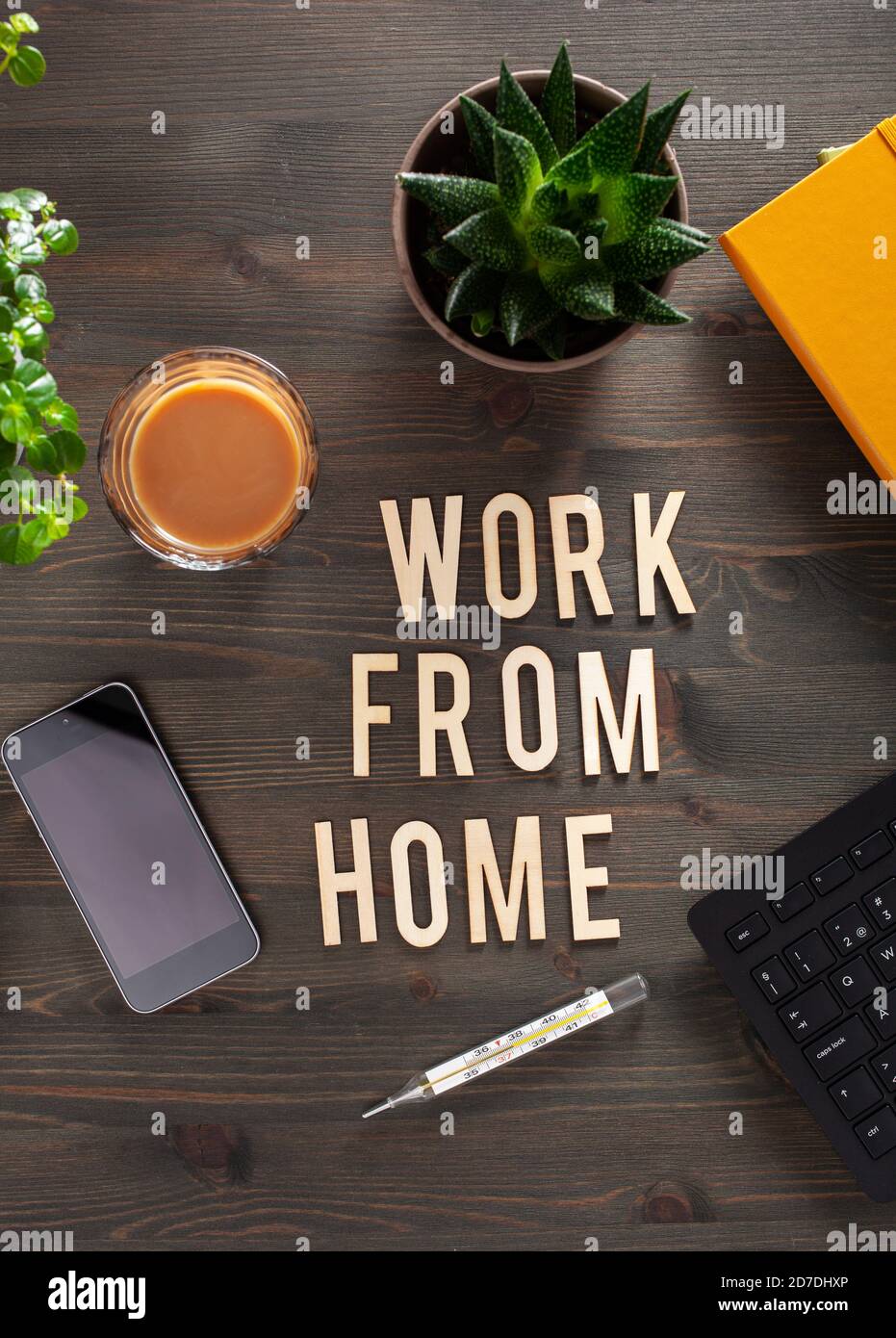 work from home text desk with keyboard computer smartphone notebook ...