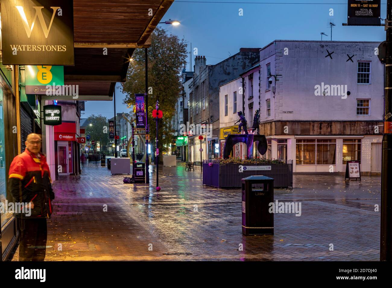 Abington street in the town centre on a wet morning in Autumn ...