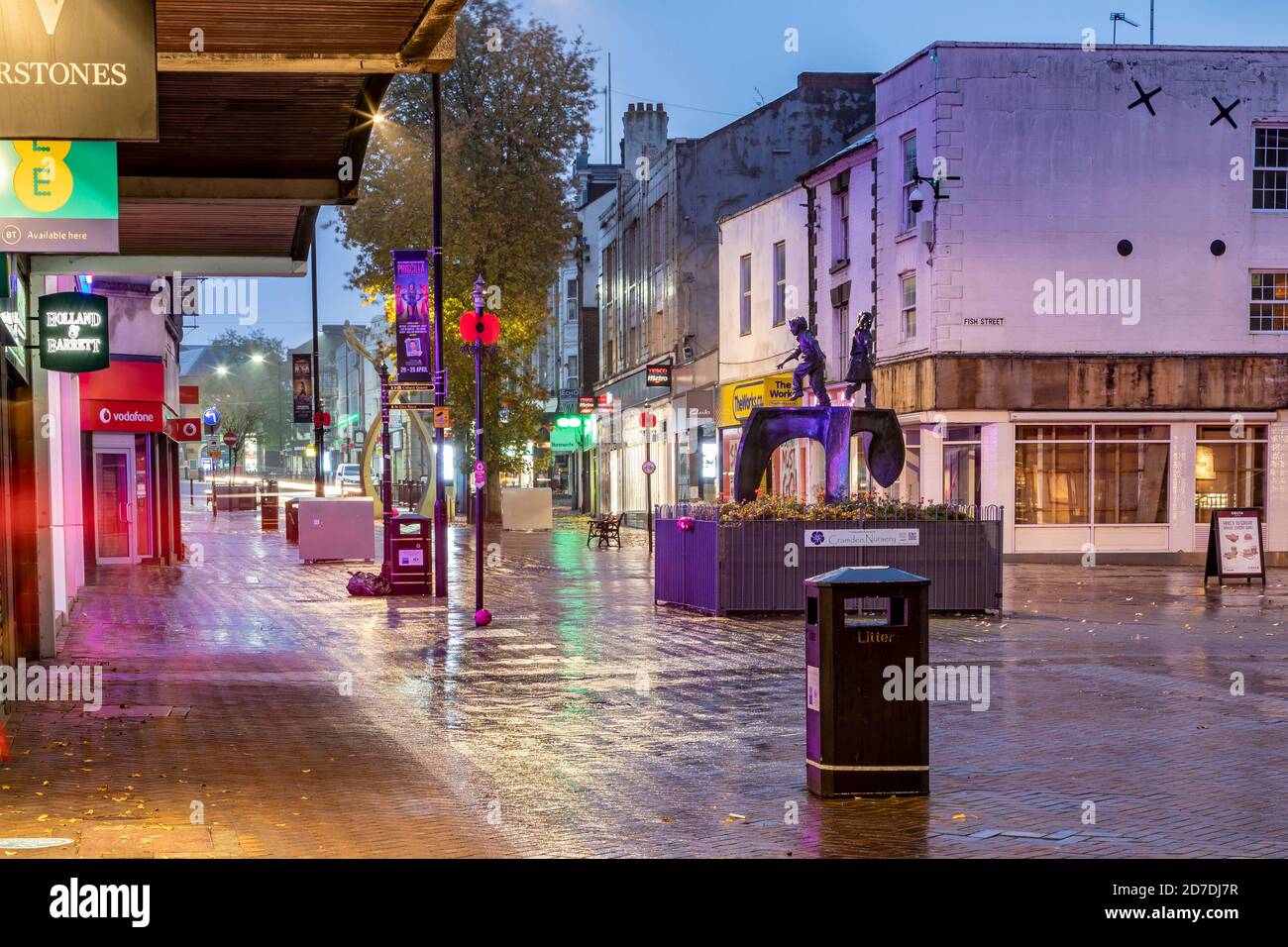 Abington street in the town centre on a wet morning in Autumn ...