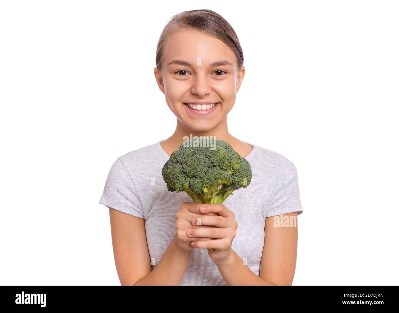 Happy beautiful young teen girl holding perfect product for dieting ...