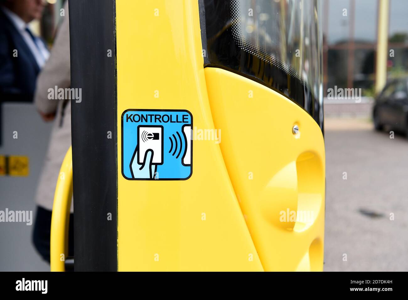 21 October 2020, Berlin: A sticker with a note on ticket control sticks ...