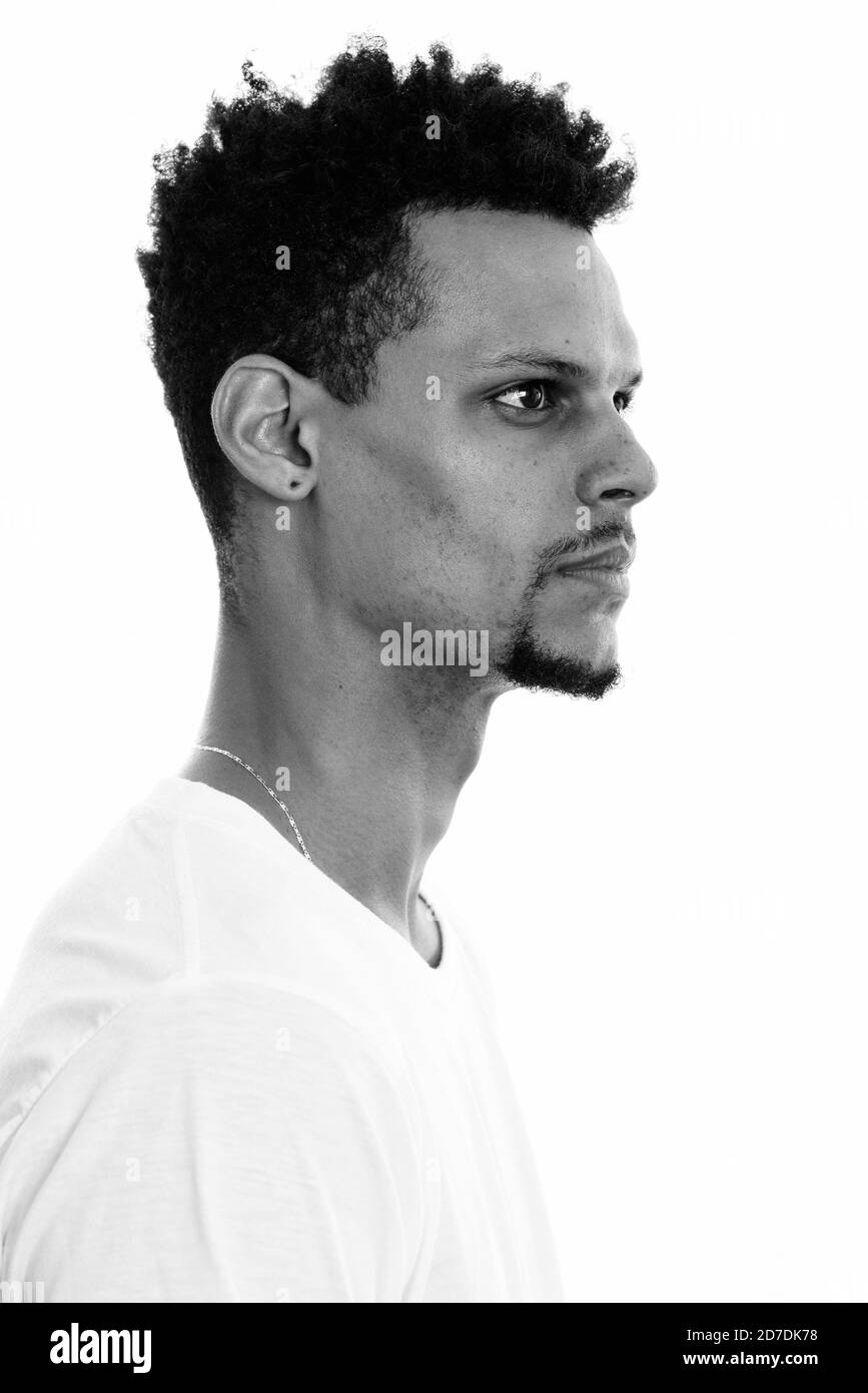 Profile view of young African man looking at distance Stock Photo - Alamy