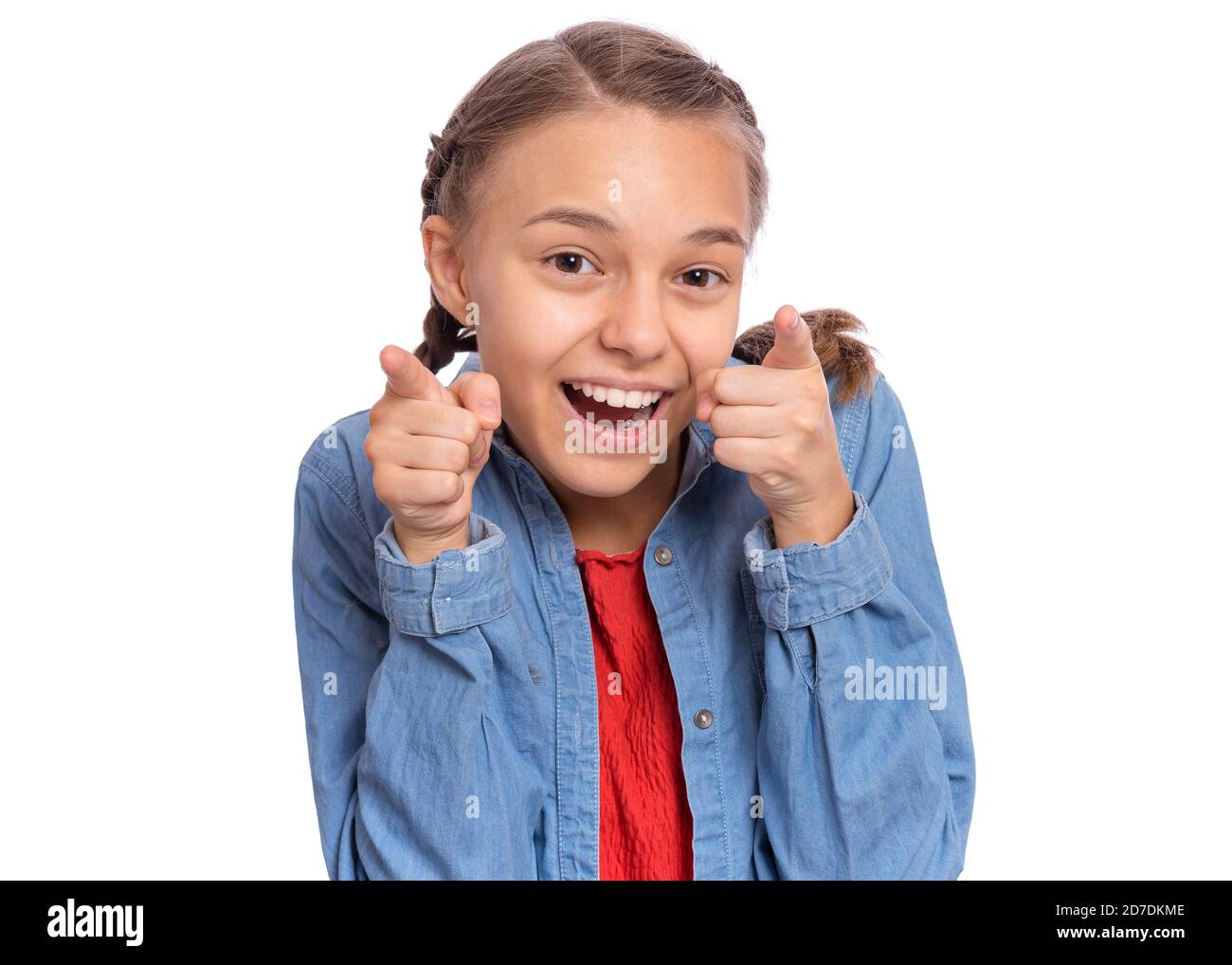 Happy teenage girl pointing up, gesturing idea or doing number one ...