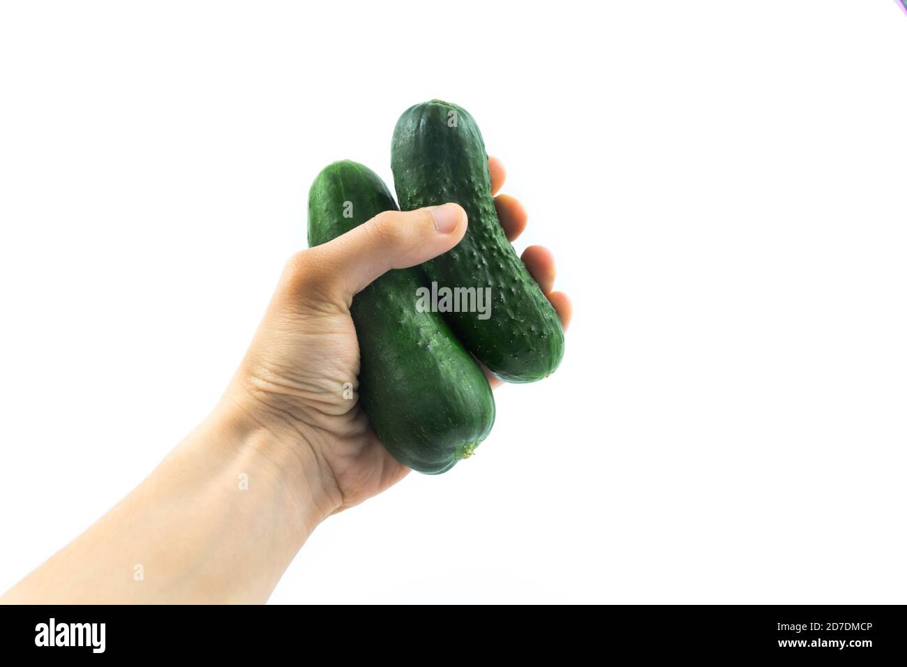Cucumbers in a man's hand, on a white isolated background Stock Photo ...