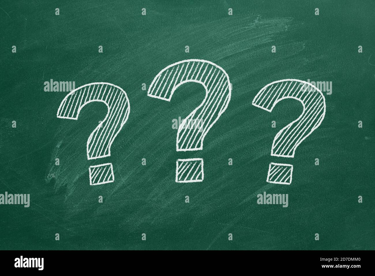 Three question marks drawn in chalk on a greenboard Stock Photo - Alamy
