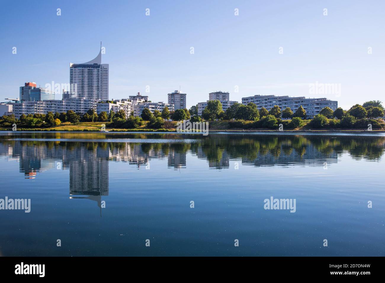 Austria, Vienna, Donau City reflecting in New Danube River Stock Photo ...