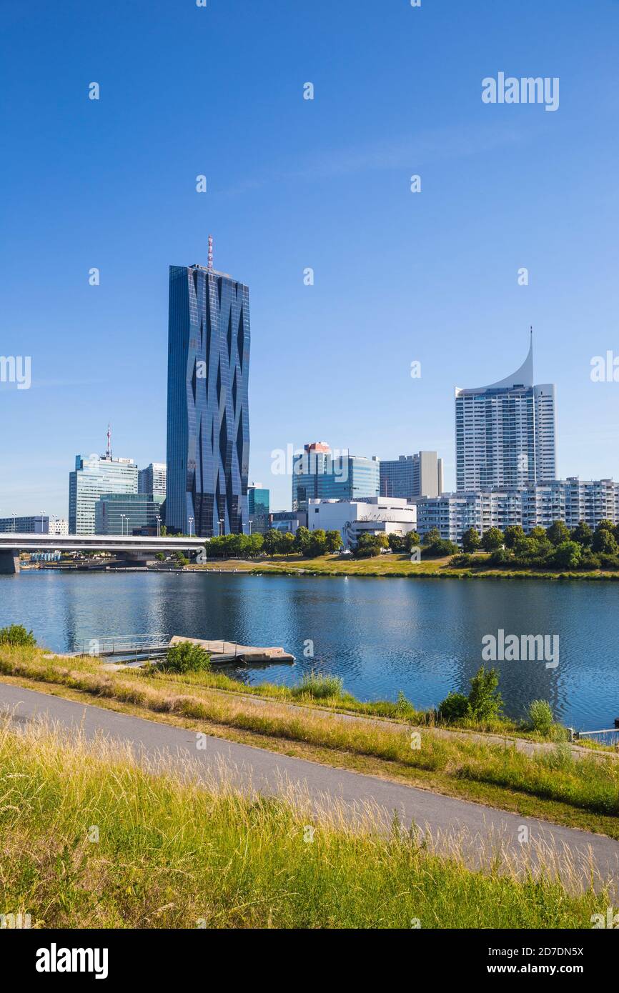 Austria, Vienna, Donau City and DC building reflecting in New Danube ...