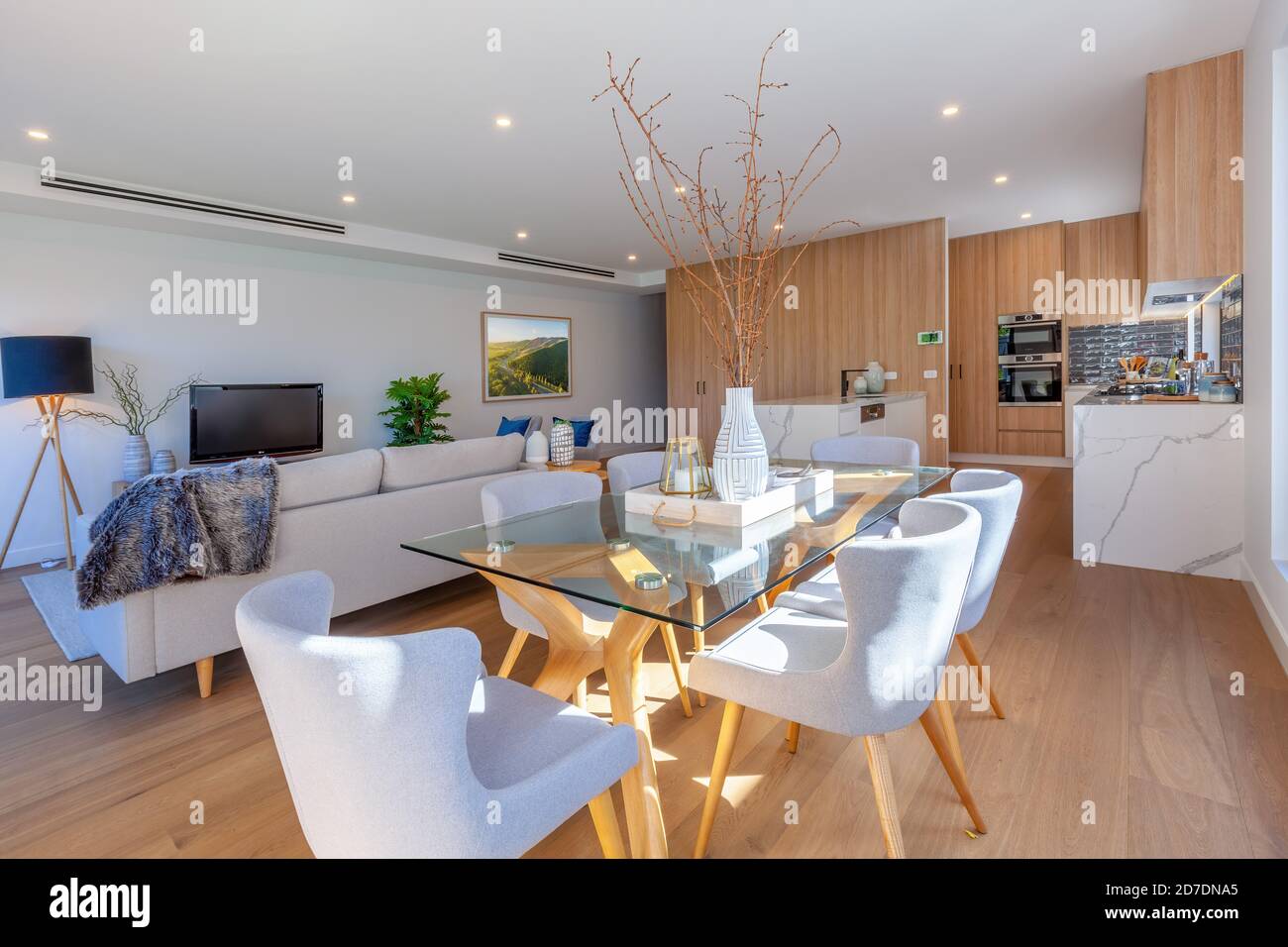 Dining table in a modern living room interior design Stock Photo - Alamy