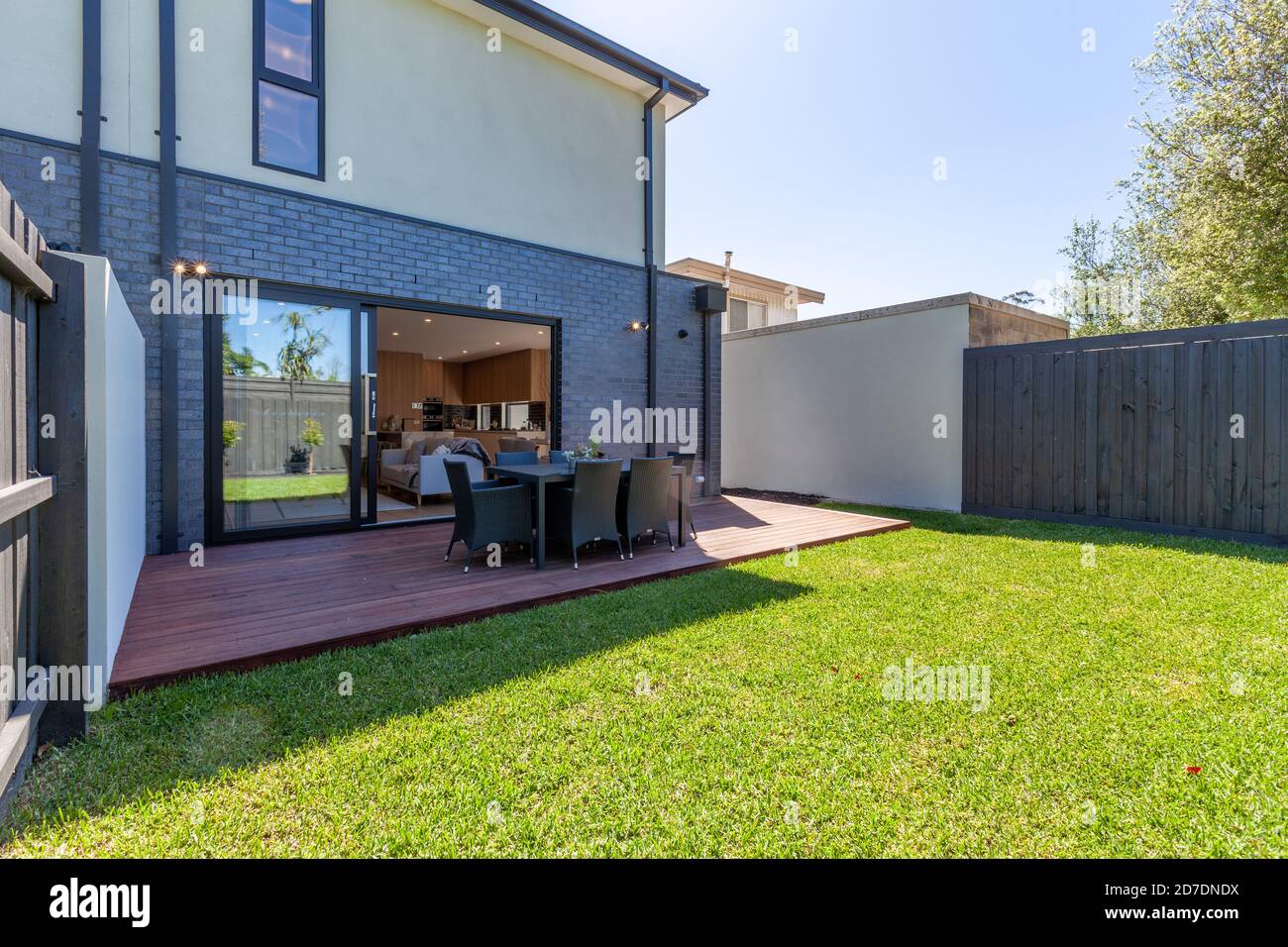 Back yard with deck and dining table in a typical suburb in Australia ...