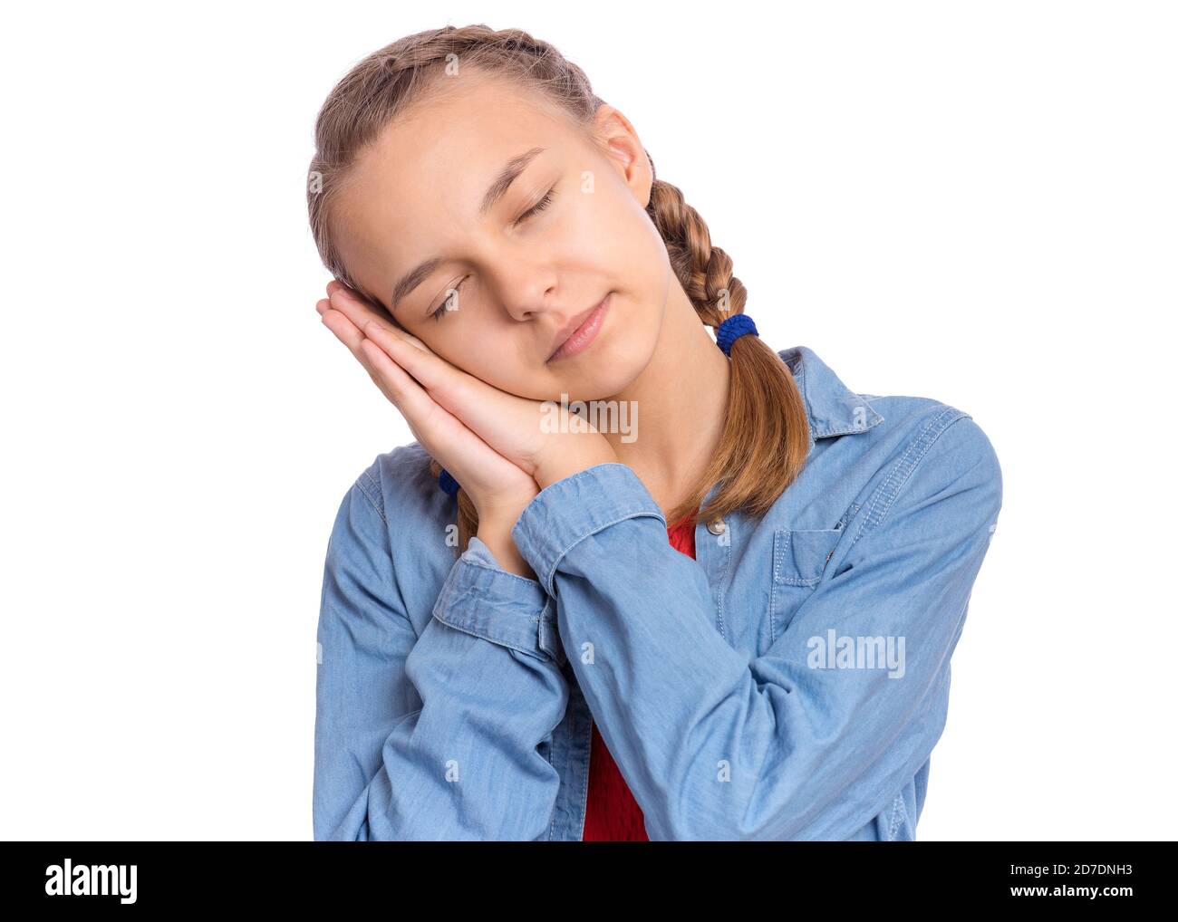 Beautiful teenage girl posing sleeping with folded hands under cheek ...