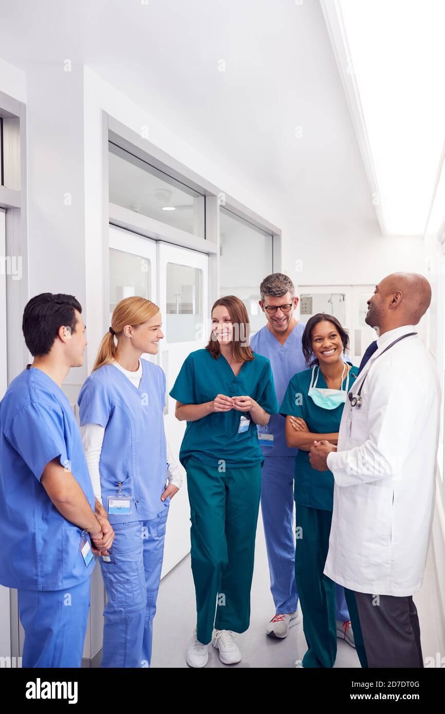 Multi-Cultural Medical Team Having Meeting In Hospital Corridor Stock Photo - Alamy