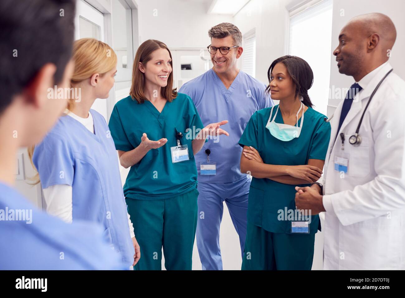 Multi-Cultural Medical Team Having Meeting In Hospital Corridor Stock Photo - Alamy