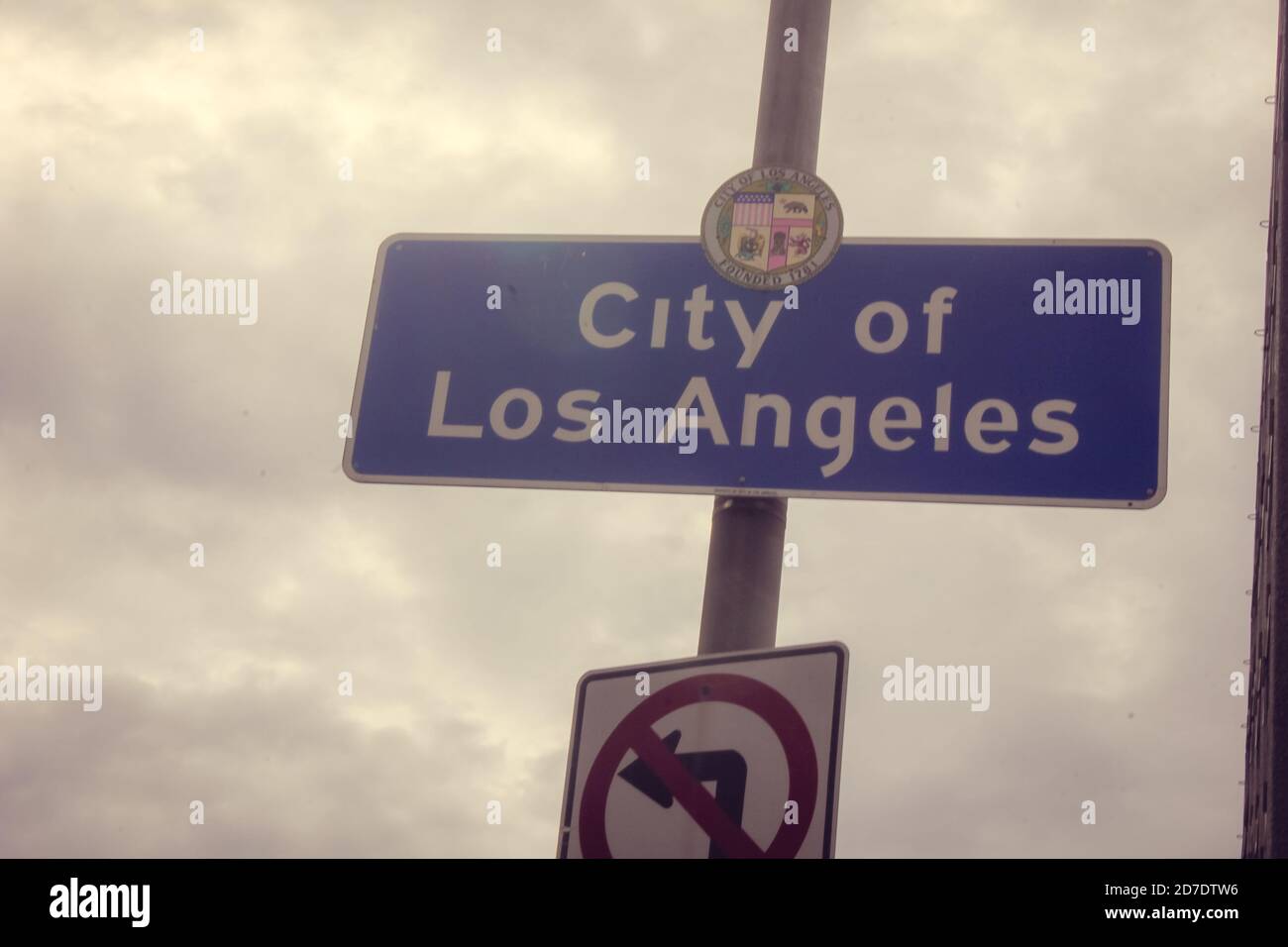Los Angeles city limit sign with towers and Palm Trees Stock Photo - Alamy
