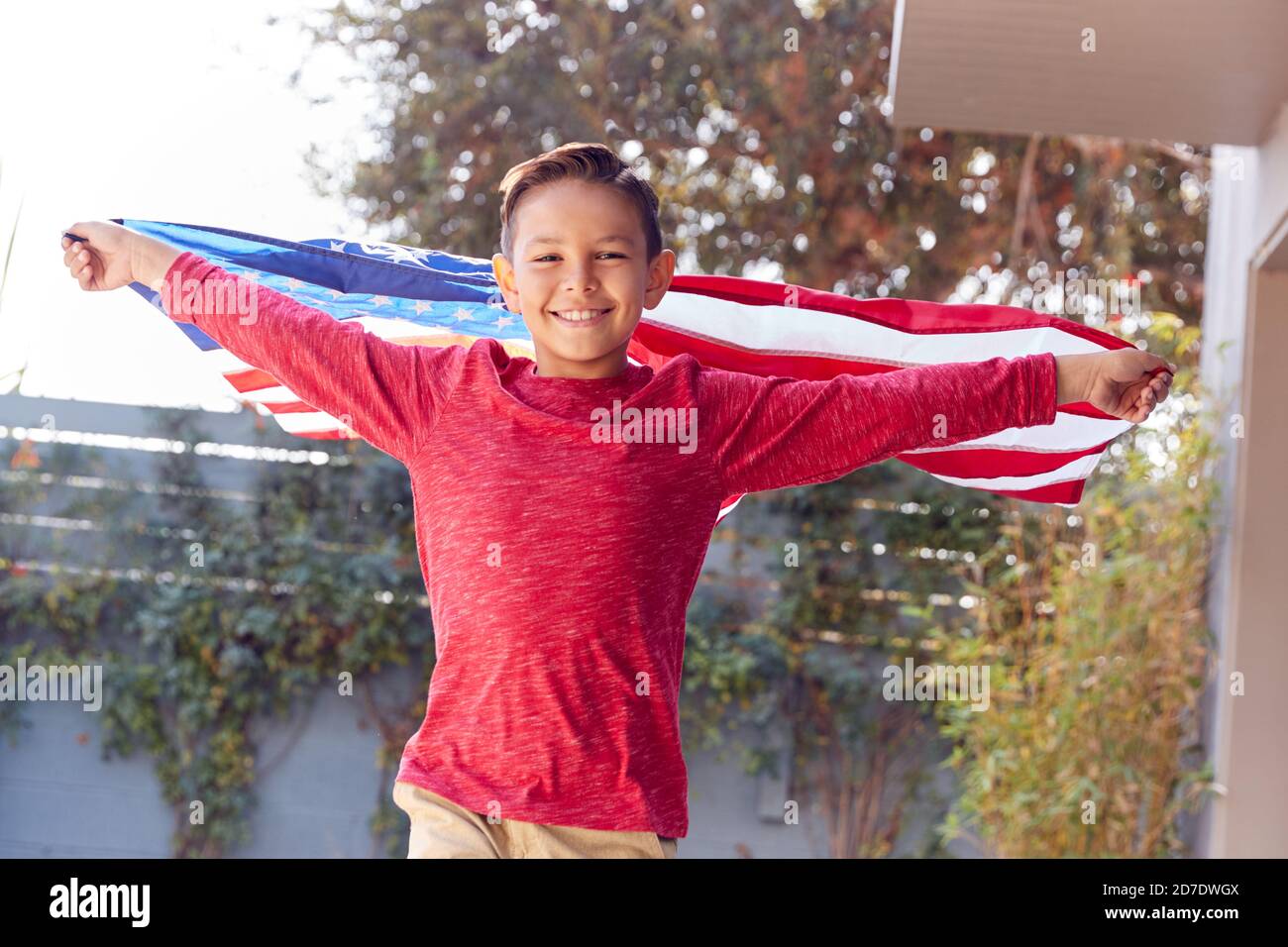 Portrait Of Proud Hispanic Boy Wrapped In Stars And Stripes American ...