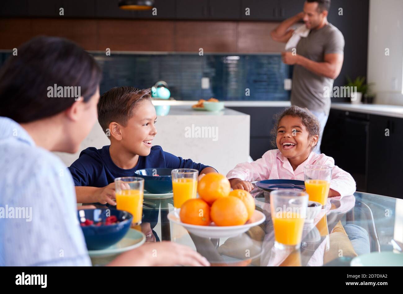 Hispanic Family Sitting Around Table Eating Breakfast Together Stock ...
