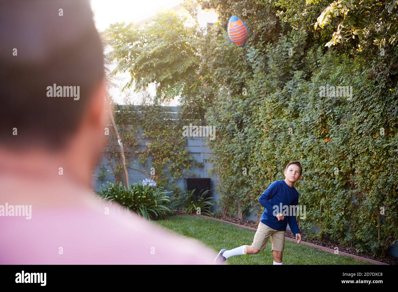 Children throwing ball together hi-res stock photography and images - Alamy