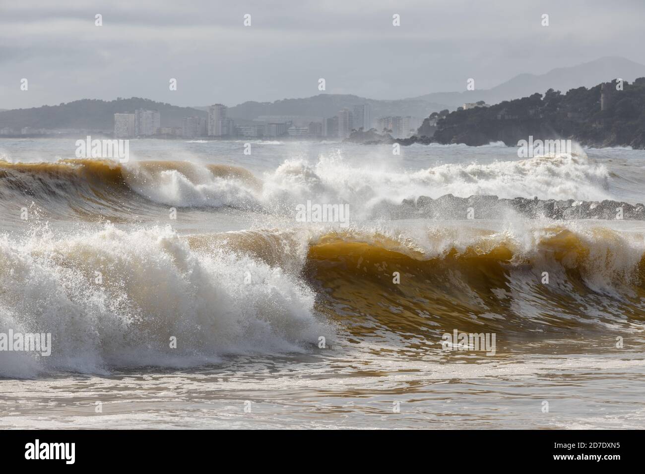 Powerful ocean wave breaking ina windy day in Spanish town Palamos in ...