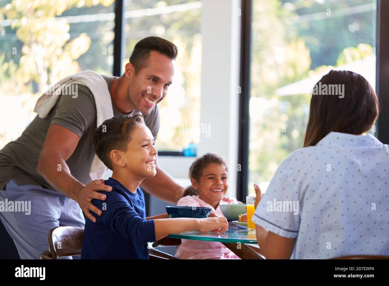 Hispanic Family Sitting Around Table Eating Breakfast Together Stock ...