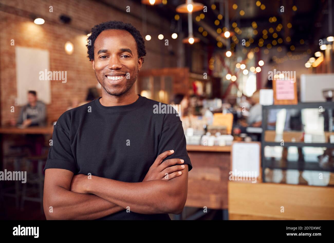 Portrait Of Male Coffee Shop Owner Standing By Counter Stock Photo - Alamy