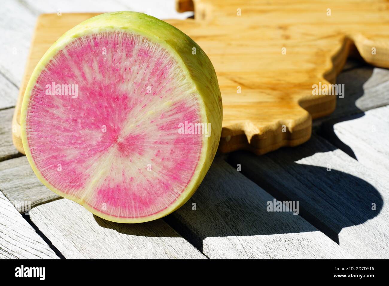 Green and pink watermelon radish cut in half Stock Photo - Alamy