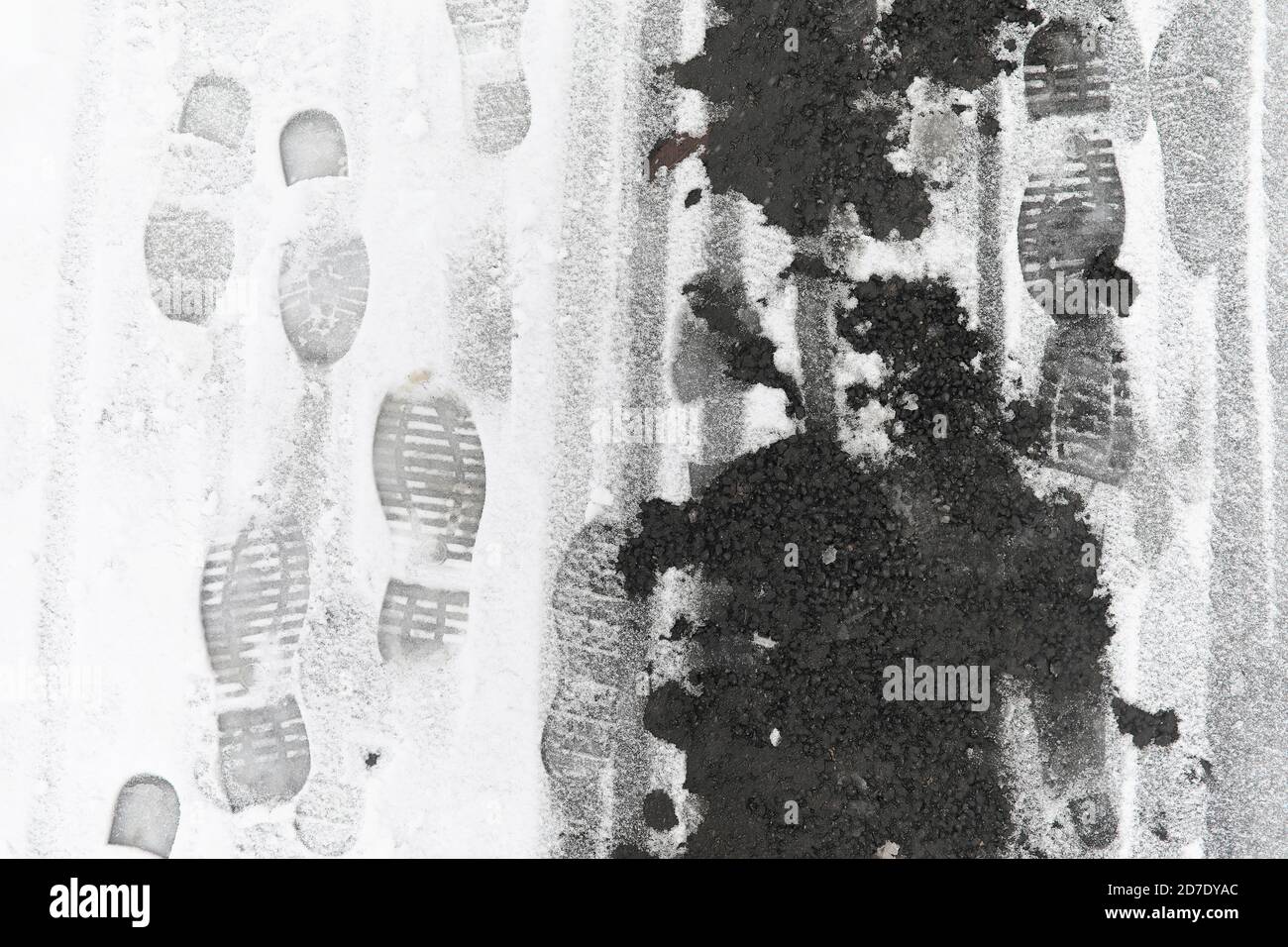 Footprints in the snow. Footprints on the first snow. Imprint of shoes ...