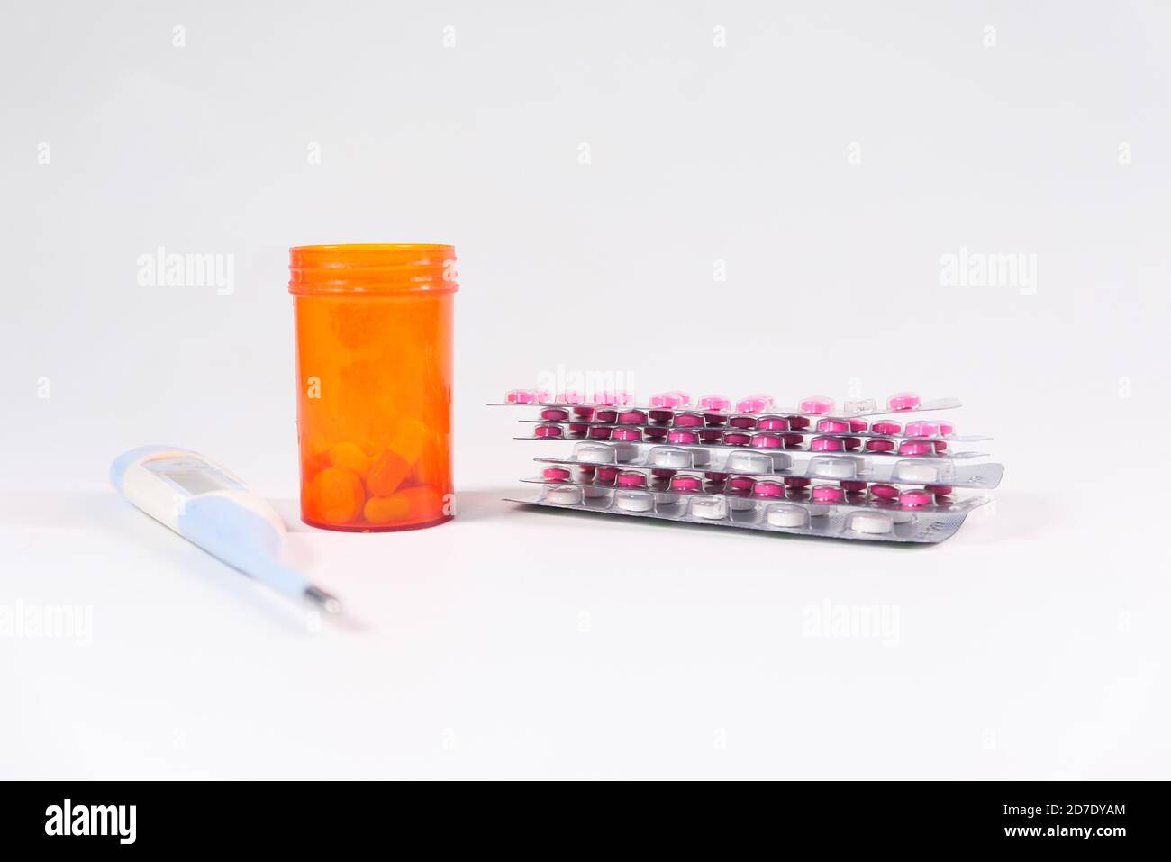thermometer , container and blister pack on white background Stock ...
