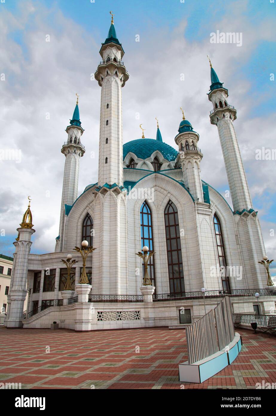 Beautiful white mosque with a blue roof against the sky with clouds ...