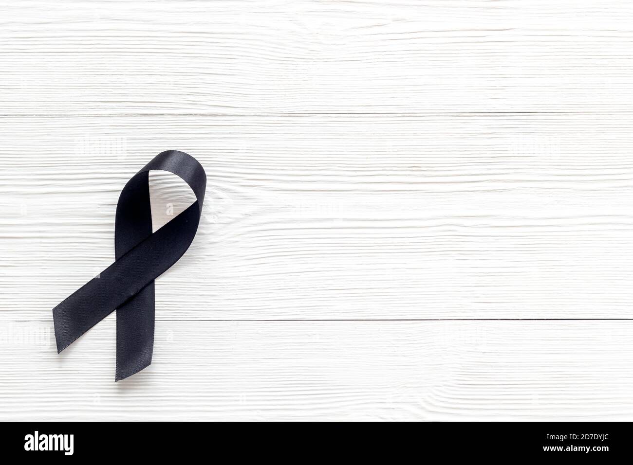 Black ribbon as mourning symbol top view Stock Photo - Alamy