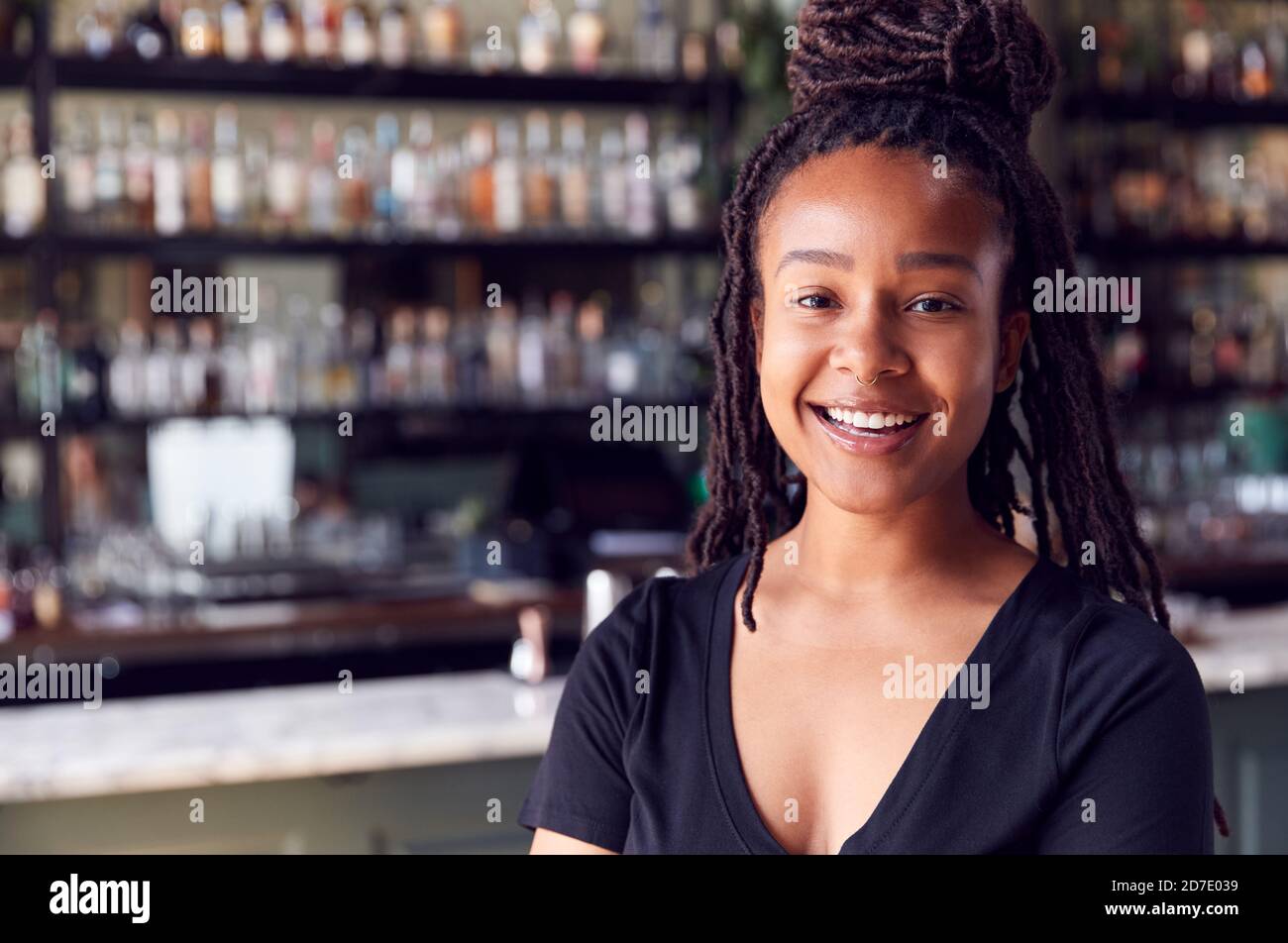 Portrait Of Confident Female Owner Of Restaurant Bar Standing By ...