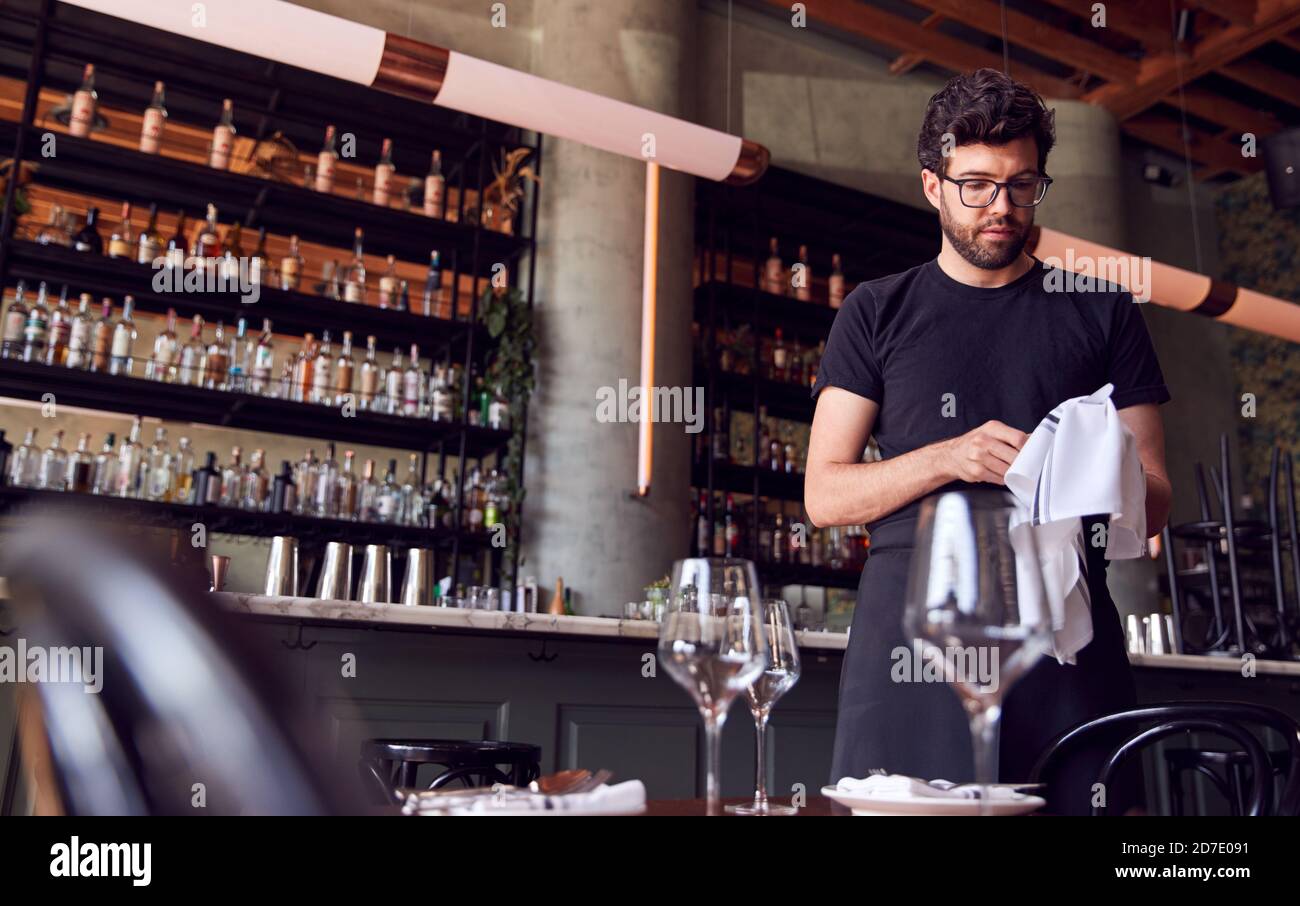 Bar waiter preparing table hi-res stock photography and images - Alamy