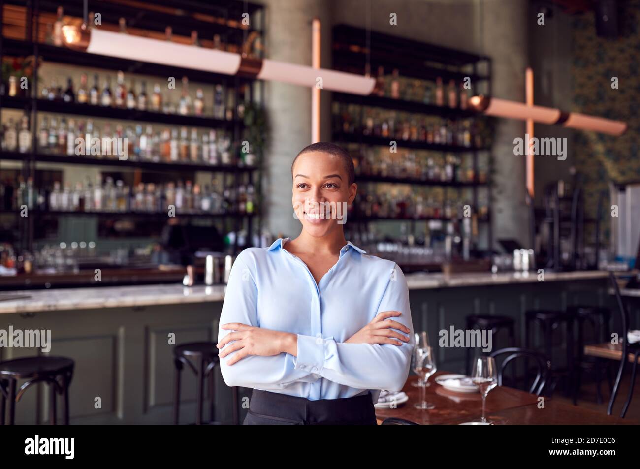 Portrait Of Confident Female Owner Of Restaurant Bar Standing By ...