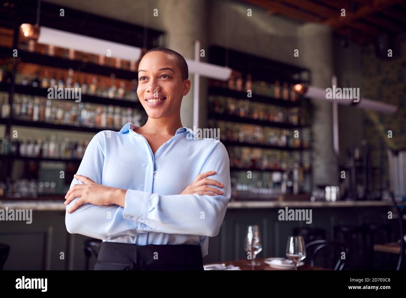 Portrait Of Confident Female Owner Of Restaurant Bar Standing By ...